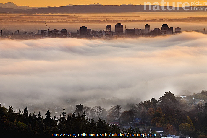 Stock photo of Smog and early winter cloud inversion layer at dawn ...