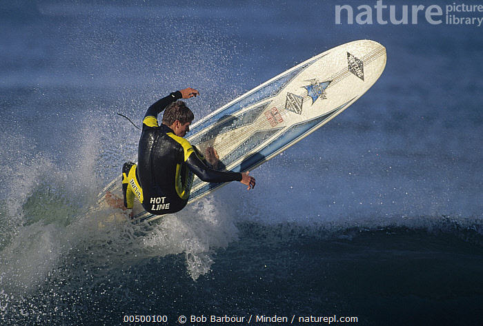 Stock photo of Surfer catching air, backside view. Available for sale ...