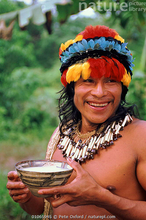 Stock photo of Indian in traditional Zaparo dress with drink ...
