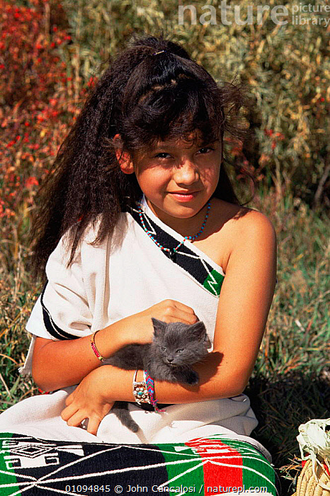 Stock photo of Native American girl in traditional clothing with kitten ...