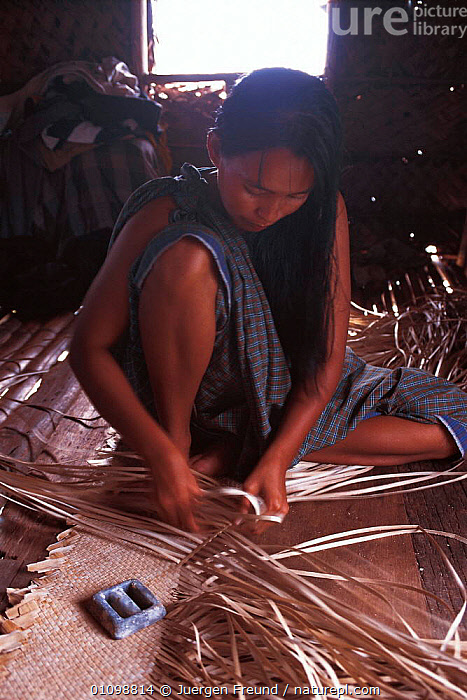 Stock photo of Bajau woman weaving mats, Malaysia. Bajau people live in ...
