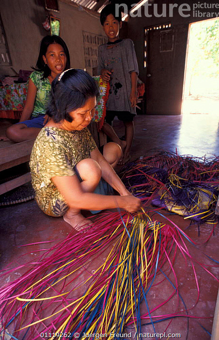 Stock photo of Fisherman's wife weaves sleeping mat, Handumon, Bohol Is ...
