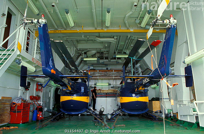 Stock photo of Helicopter hangar with two expedition helicopters inside ...