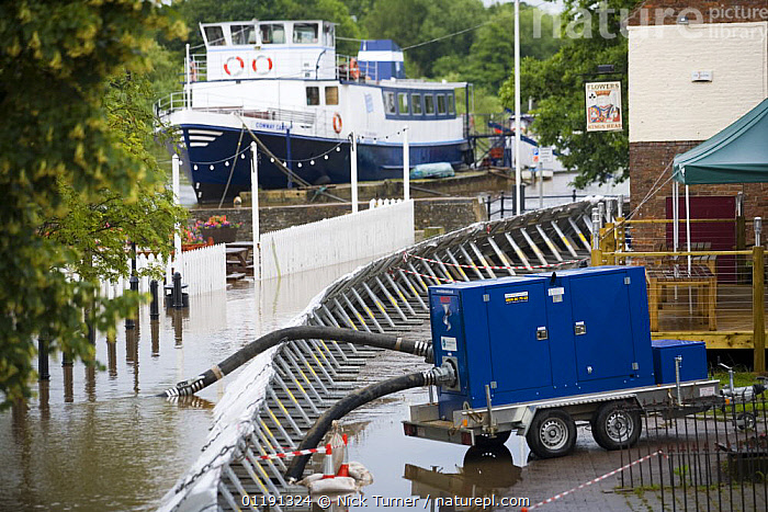 Stock photo of Temporary flood barriers and pumping machine erected at ...