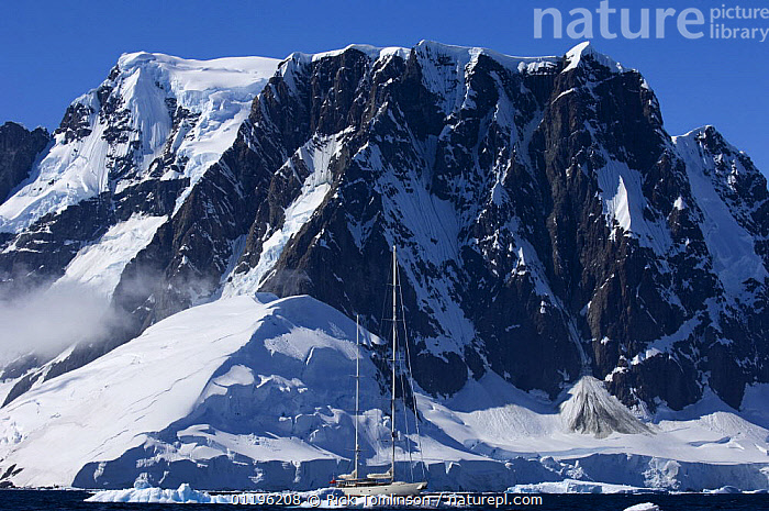 Stock photo of SY "Adele", 180 foot Hoek Design, dwarfed by dramatic ...