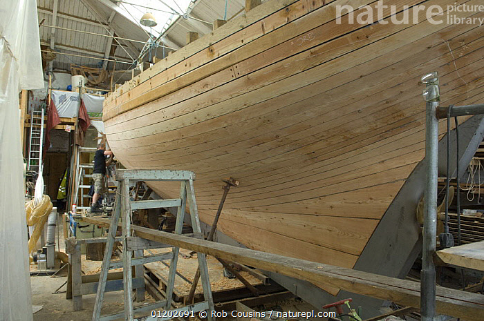 Stock photo of Shipwrights fairing the hull of Bristol Channel Pilot ...