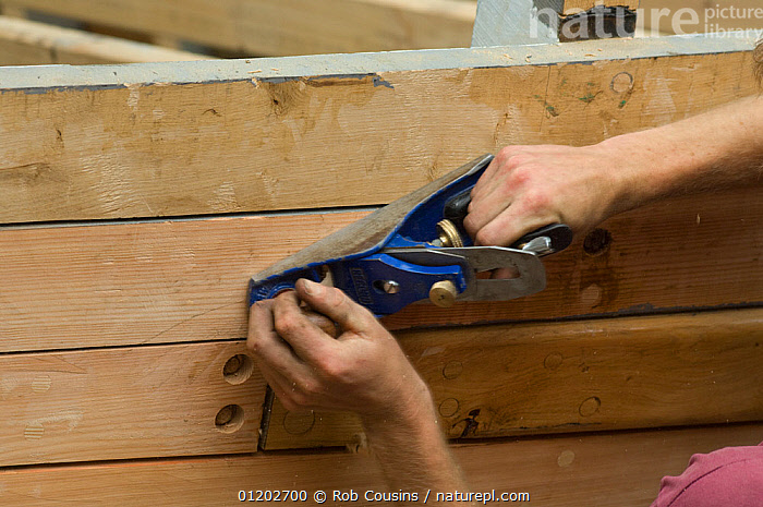 Stock photo of Shipwright planing carvel planked hull of Bristol ...
