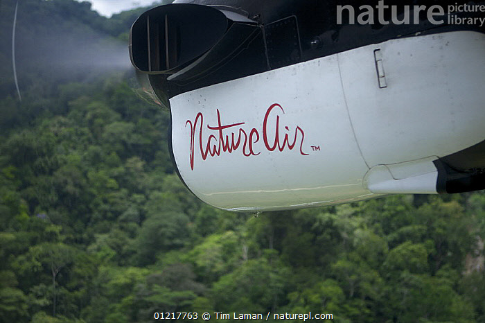 Stock photo of 'Nature Air' aircraft flying over rainforest. This ...