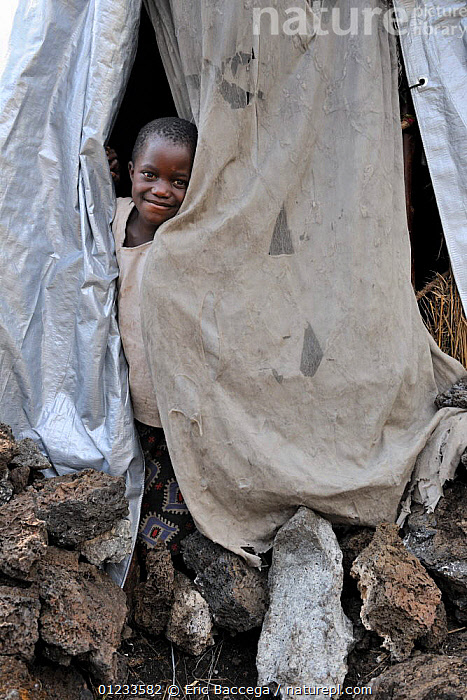 Stock photo of Child peering out of tent at the refugee camp Mugunga 1 ...