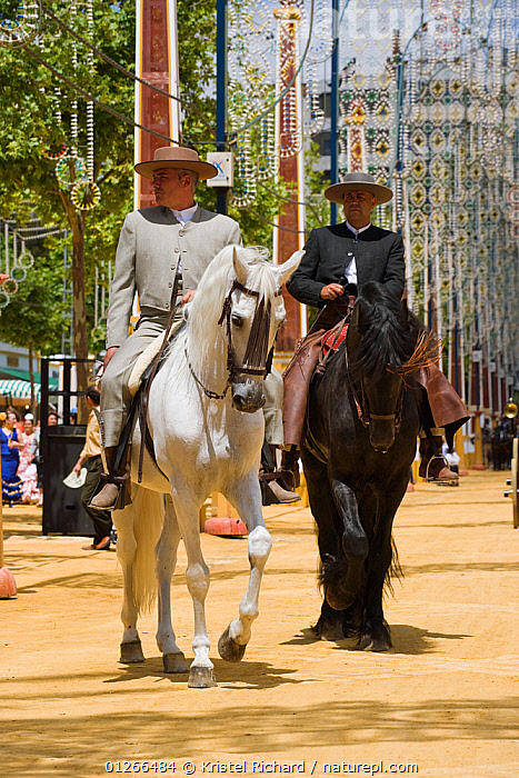 Stock photo of Two traditionally dressed Andalusian gentlemen parade ...