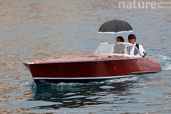 Stock photo of Classically dressed couple on Riva motorboat. Monaco ...