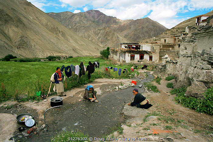 Stock photo of Villagers washing clothes in stream, Rombuk village ...