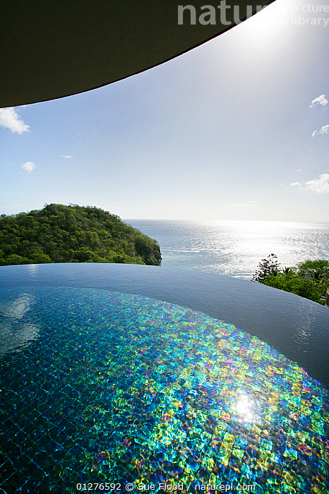 Stock photo of Infinity edge swimming pool looking over sea, Jade ...