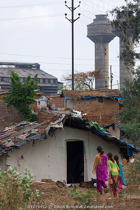 Stock photo of Family entering house in industrial slum, Bhopal, Madhya ...