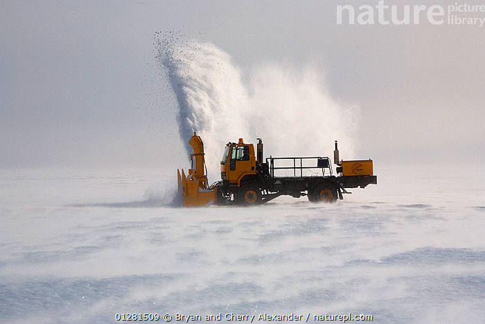 Stock photo of Large snow blower clearing snow off the Blue Ice Runway ...