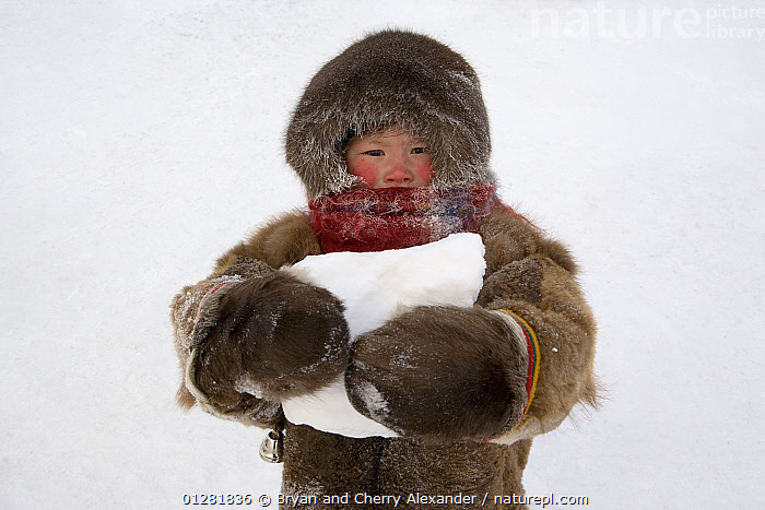 Stock photo of Nenets girl, warmly dressed in reindeer skin clothing ...