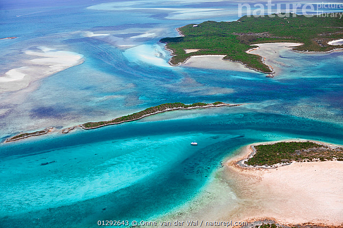 Stock photo of Aerial view of the Exumas, with a lone yacht. Bahamas ...