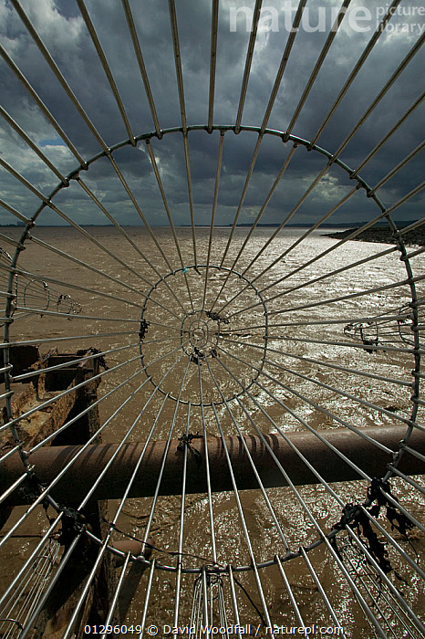 Stock photo of Approaching rainstorm viewed through fishing putcher ...