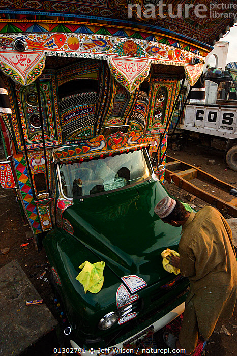 Stock photo of Lorry driver polishing his vehicle, Peshawar, Pakistan ...