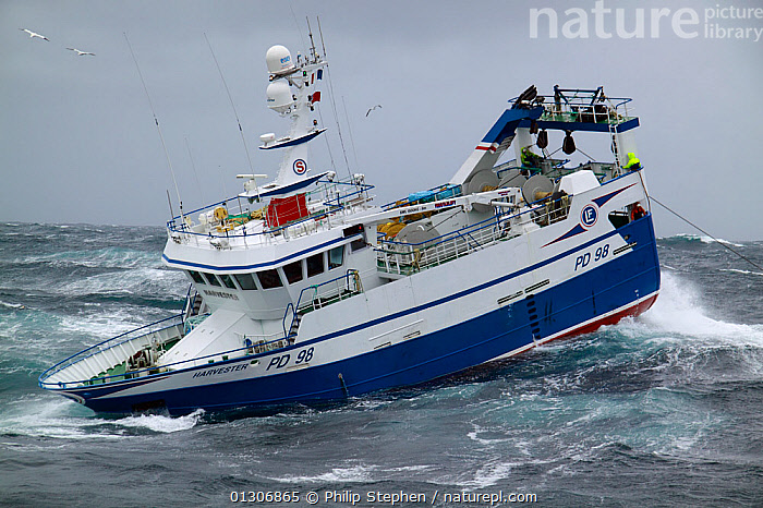 Stock photo of Fishing vessel "Harvester" heaving trawl wire onboard on ...