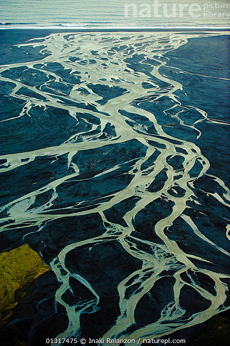 Stock photo of Aerial view of river delta, black volcanic sand, South ...
