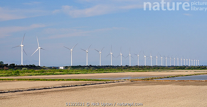 Stock photo of Windfarm with twenty-five wind turbines in a row, near ...