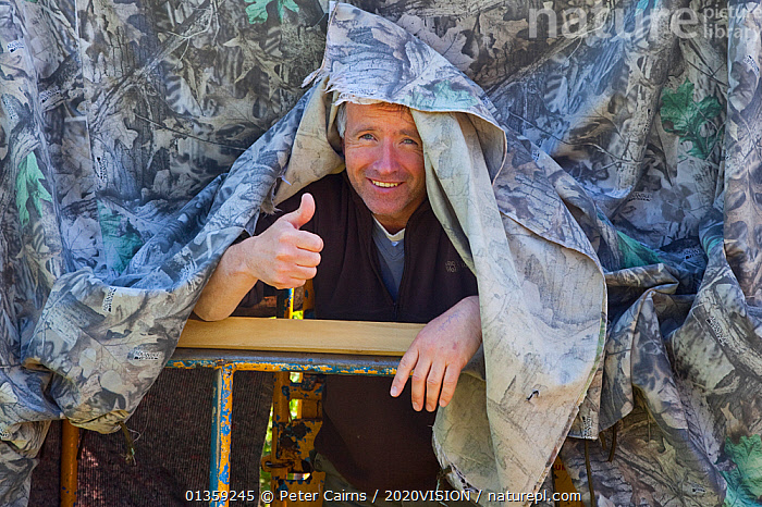 Stock photo of Photographer Peter Cairns in hide on mechanical ...