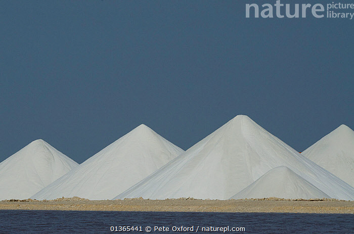Stock photo of Salt mounds and evaporation ponds (sea salt production ...