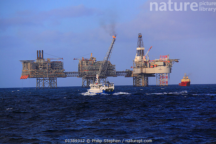 Stock photo of Trawler passing the Buzzard offshore production field on ...