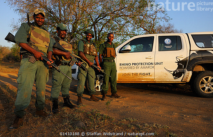 Stock photo of The anti poaching patrol, guards posing by vehicle ...