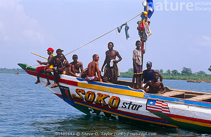 Stock photo of People aboard passenger and cargo boat. Port Loko ...