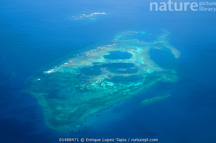 Stock photo of Aerial view of atolls with surrounding coral reefs, off ...