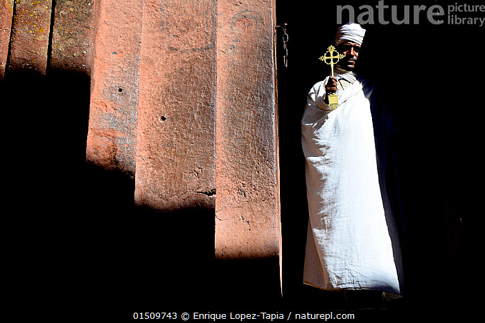Stock photo of Priest in traditional white robes and turban, holding a ...