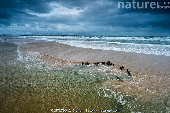 Stock photo of Wreck of Brig Athena under stormy skies, Malltraeth Bay ...