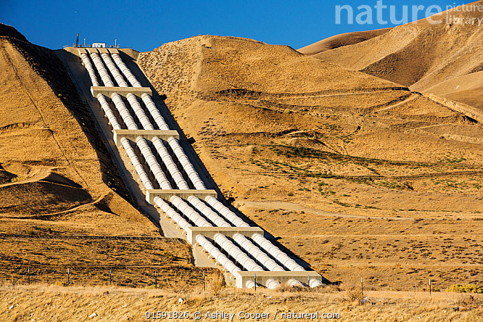 Stock photo of Pumping station sending water uphill over the mountains ...
