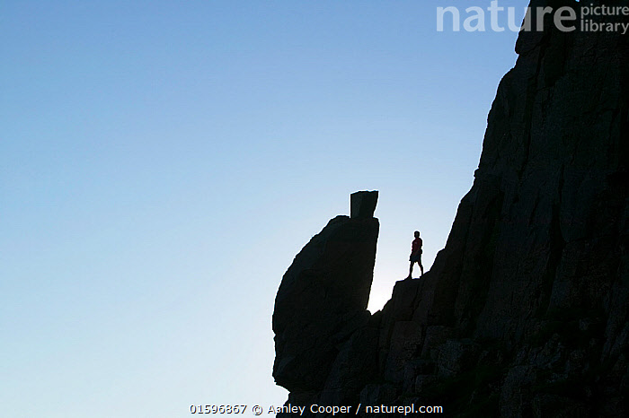 Stock photo of Climber silhouetted by the Spinx rock on Great Gable in ...