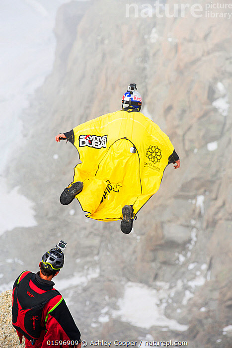 Stock photo of Base jumpers wearing wing suites jumping from the ...
