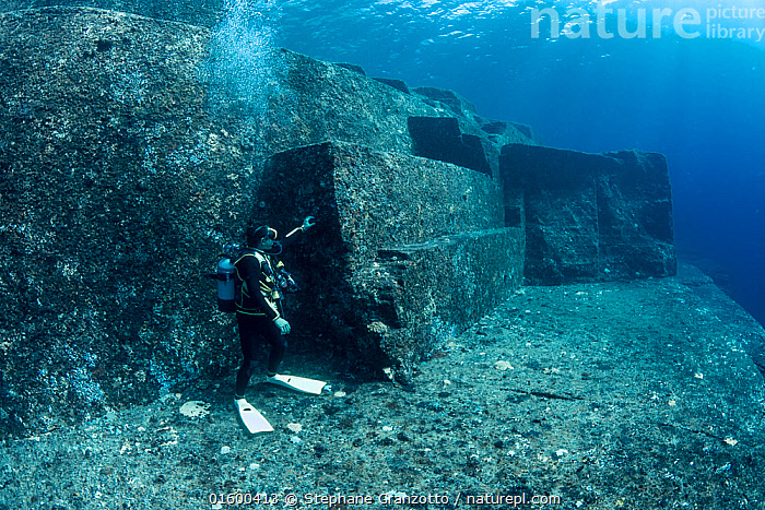 Stock photo of Scuba diver exploring the Yonaguni Monument, a submerged ...
