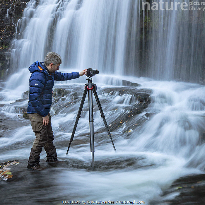 Stock photo of Photographer Guy Edwardes working in river in the Brecon ...