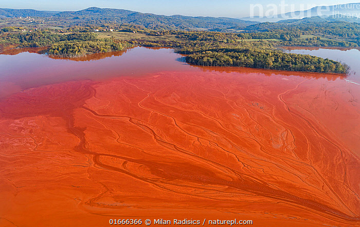 Stock photo of Aerial view of red mud deposits in storage pond. A ...