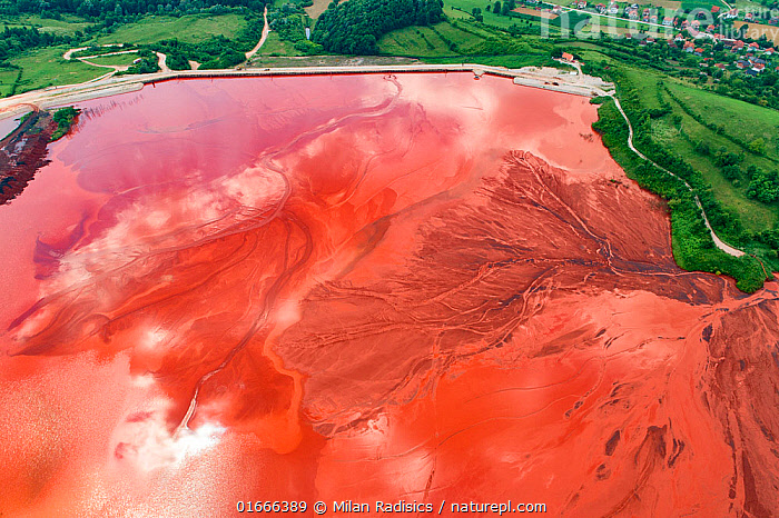 Stock photo of Aerial view of red mud deposits in storage pond. A ...