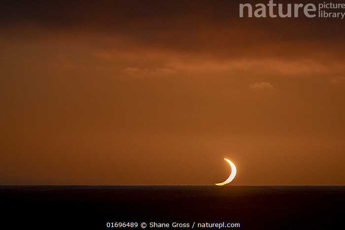 Stock photo of A total solar eclipse on the horizon over the Southern ...