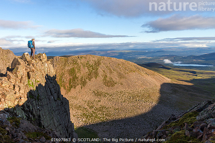 Stock photo of A lone hiker looking out over Coire an t-Sneachda ...