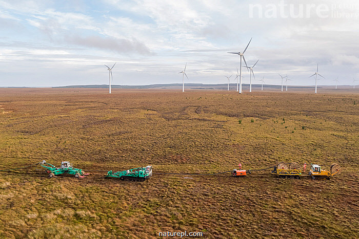 Stock photo of Aerial view of contractors using a spider plough to lay ...