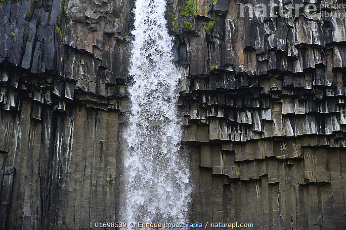 Stock photo of Svartifos waterfalls hiding wall of basalt columns ...