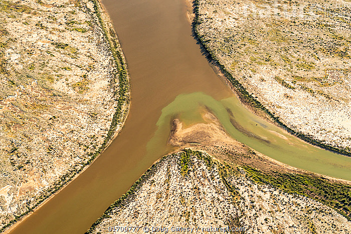 Stock photo of Aerial view of desert river and water channel filled and ...