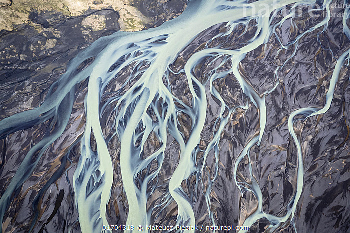 Stock photo of Aerial view of a glacial river flowing from glacier ...