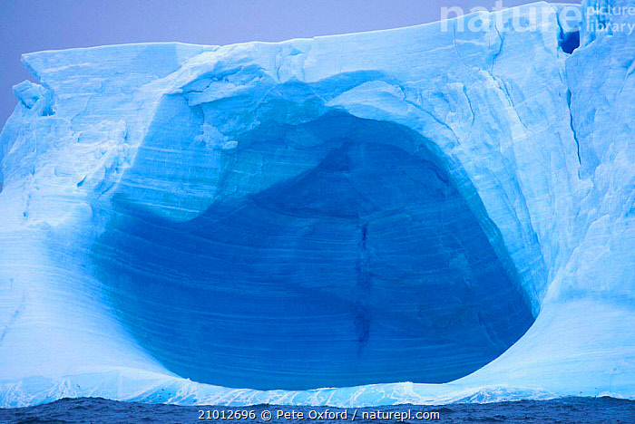 Stock photo of Iceberg cave in southern ocean Antarctica. Available for ...